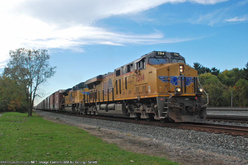 UP 7514 takes a mixer east.